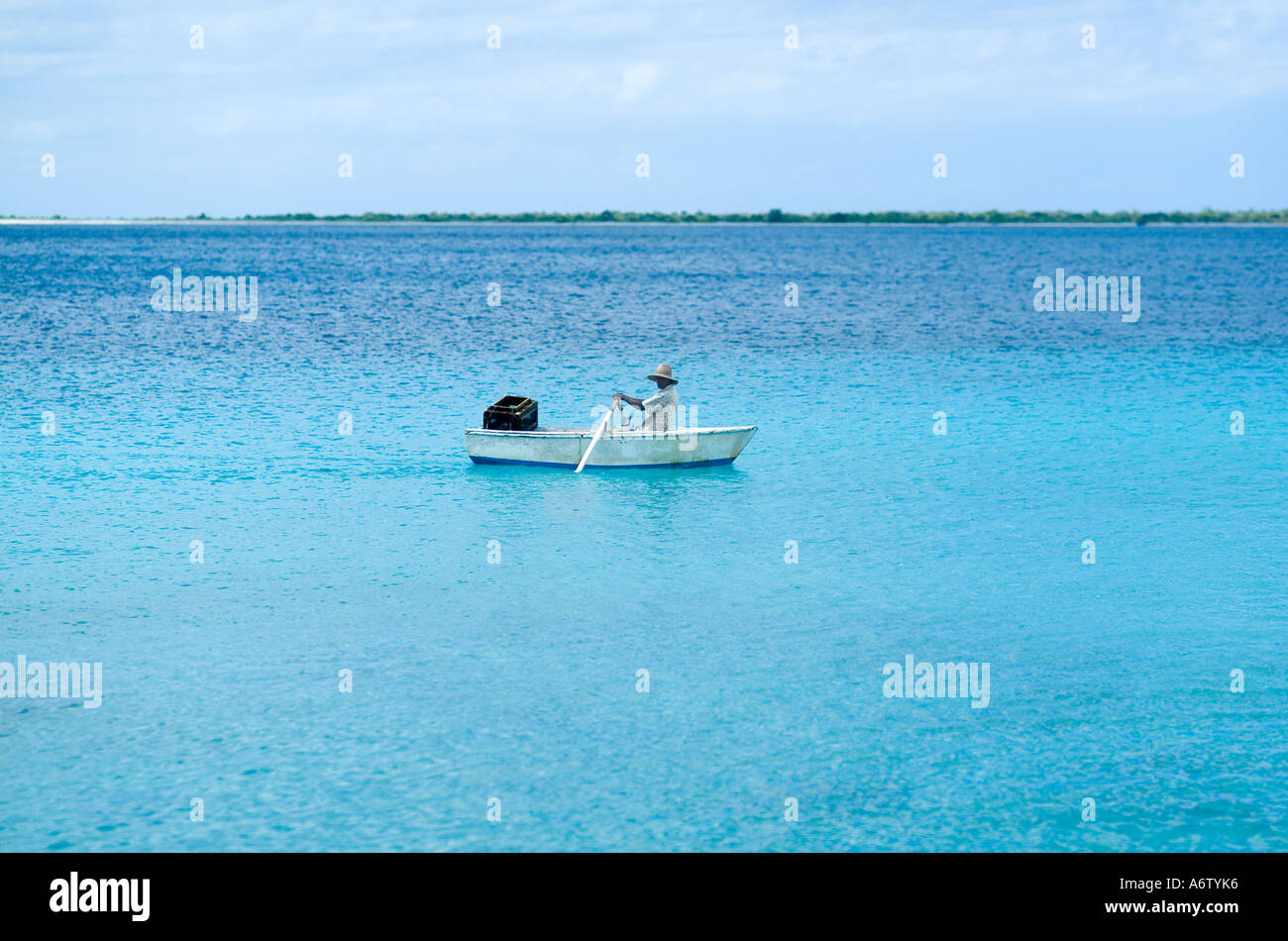 Caribean fisherman rowing Stock Photo - Alamy