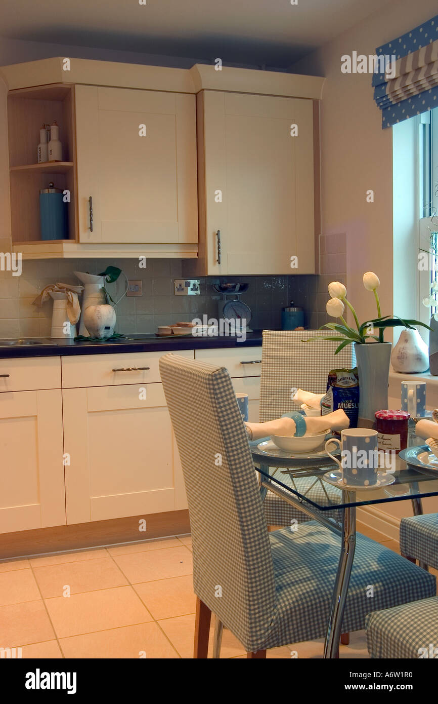 Kitchen table laid with breakfast in a modern family kitchen Stock ...
