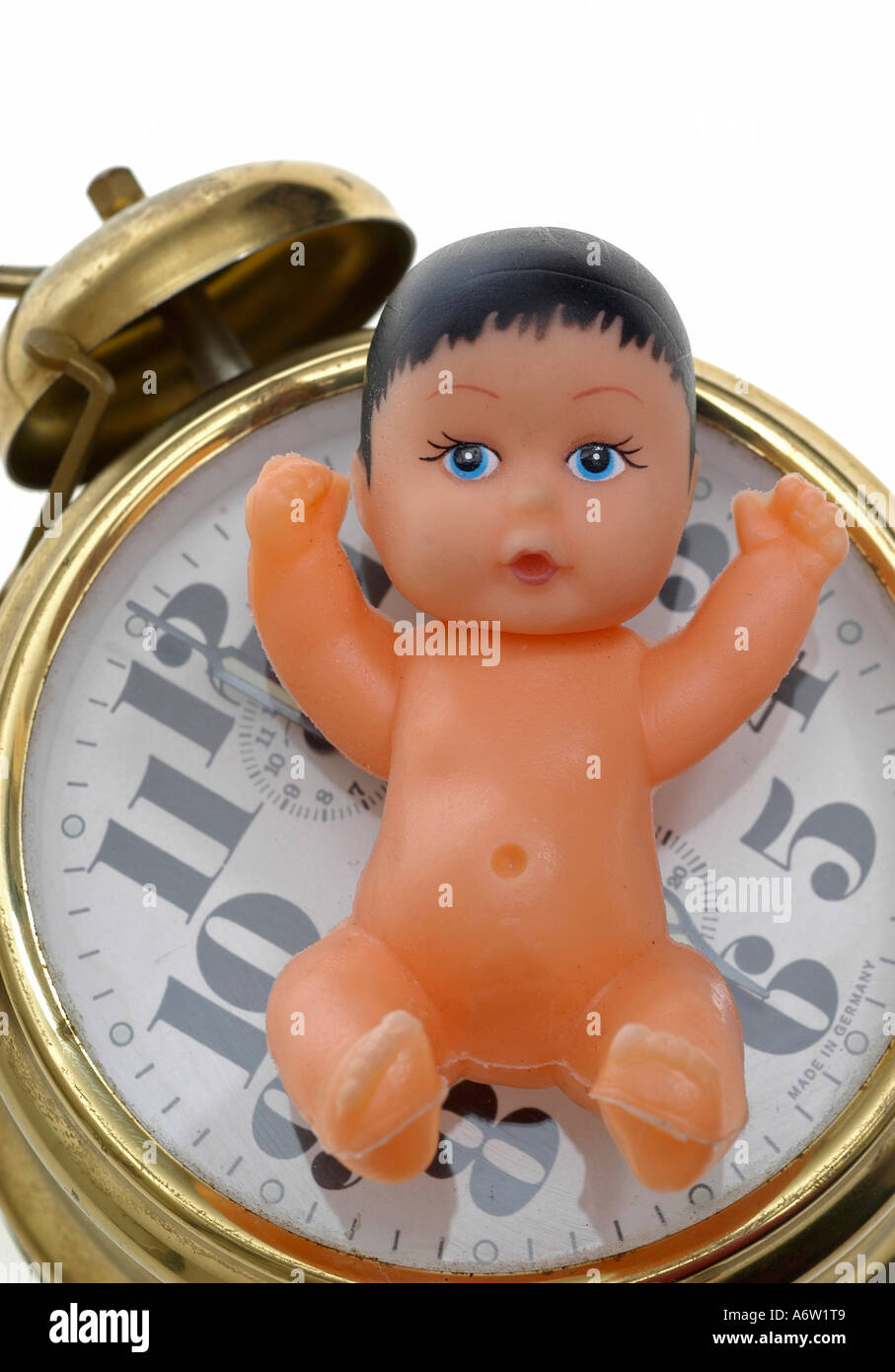 babydoll and clock Stock Photo - Alamy