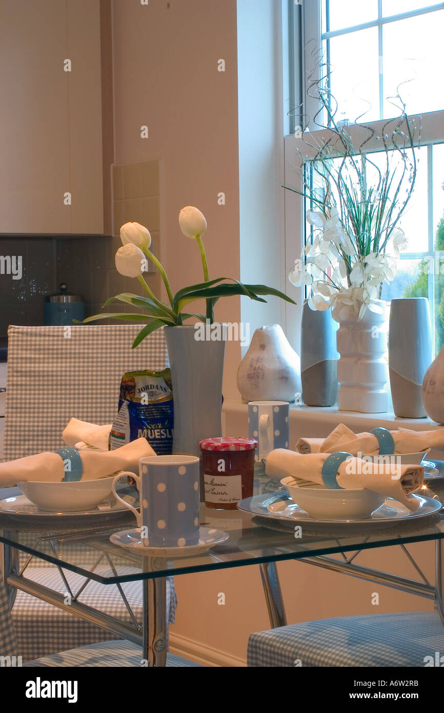 Kitchen table laid with breakfast in a modern family kitchen Stock ...