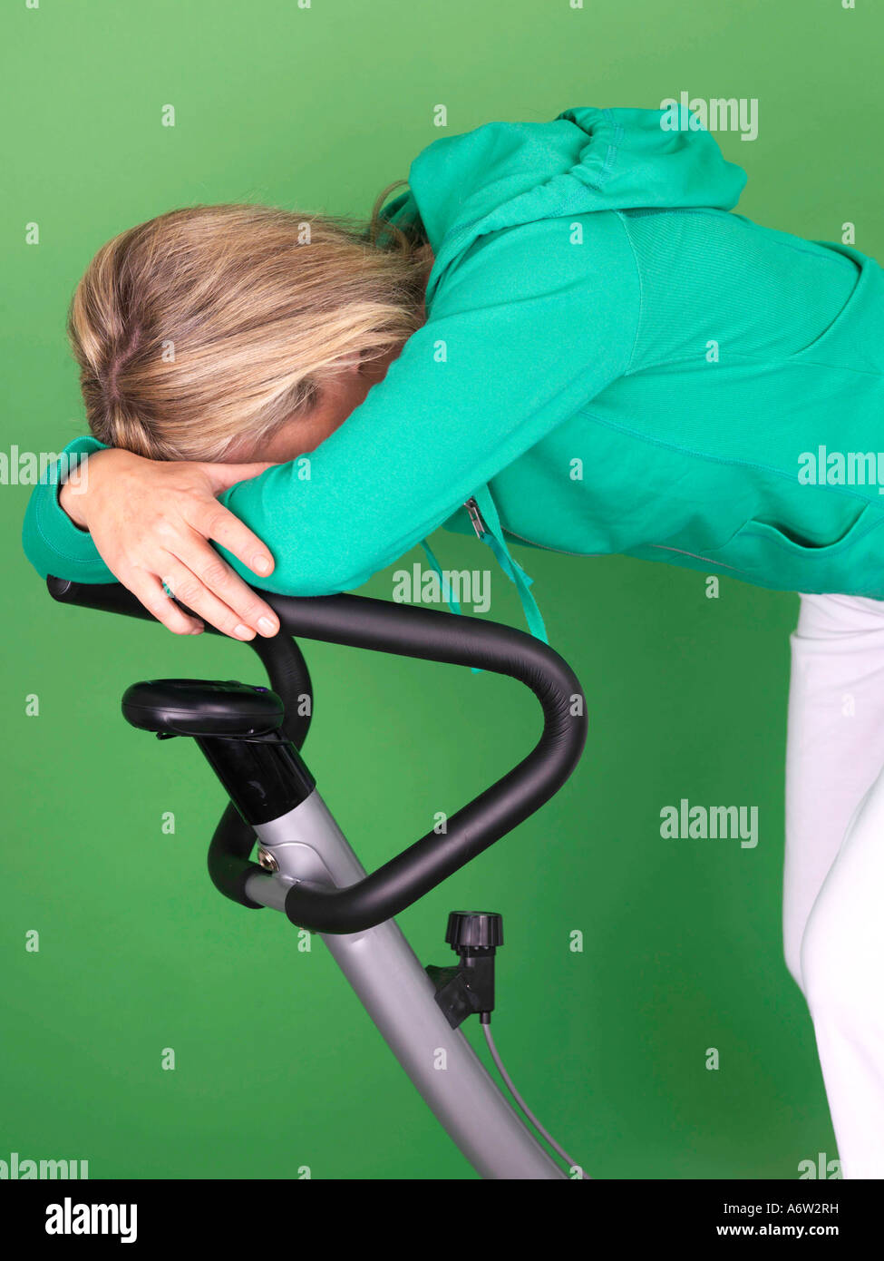 Woman Using Exercise Bike Model Released Stock Photo - Alamy