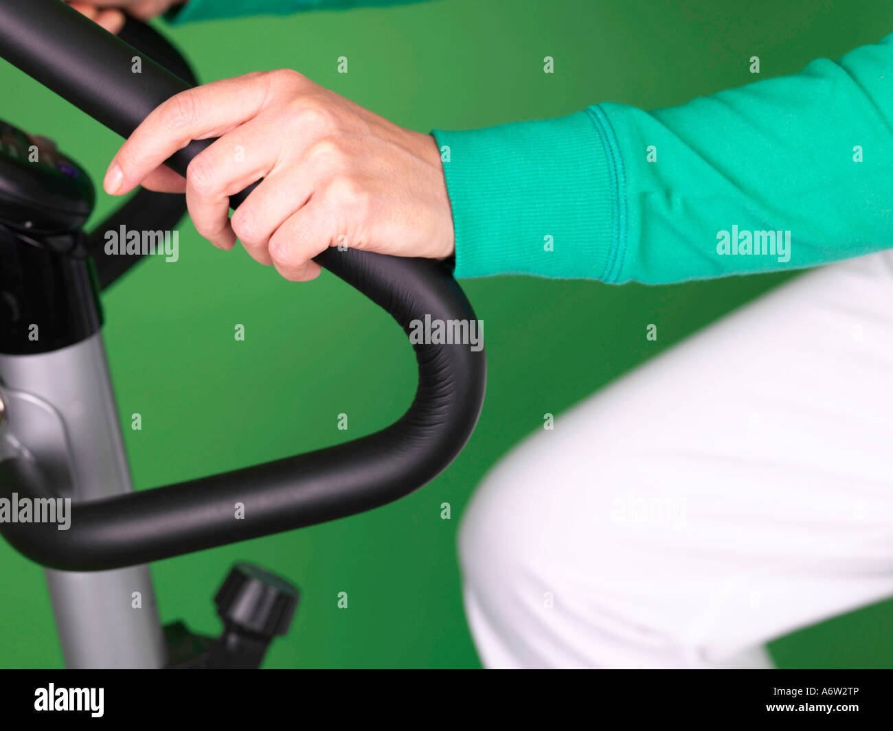 Woman Using Exercise Bike Model Released Stock Photo - Alamy