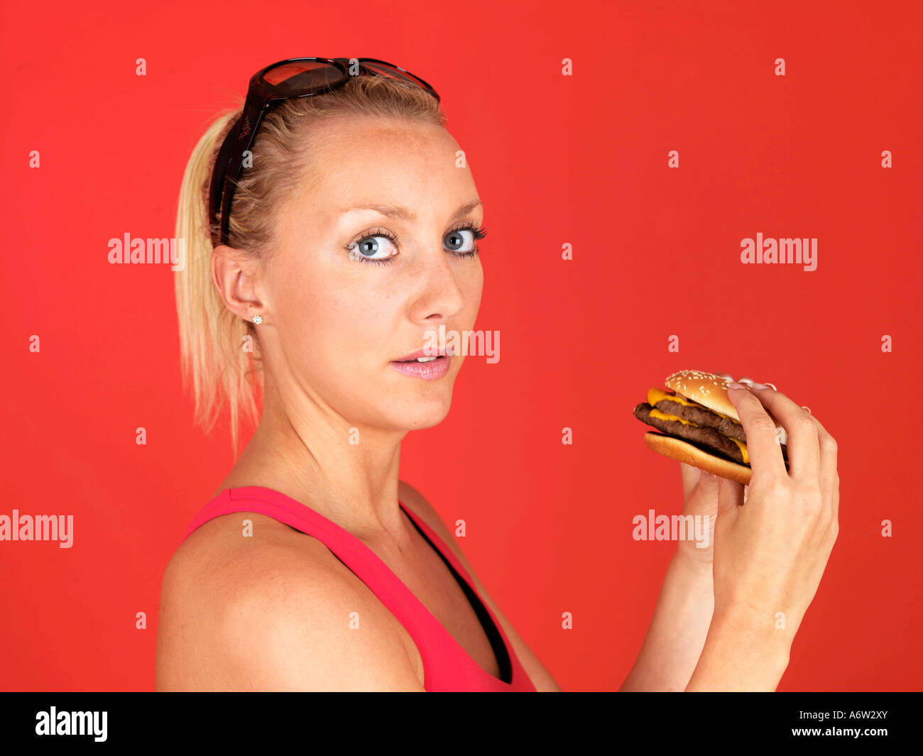 Young Woman Eating Cheeseburger Model Released Stock Photo - Alamy