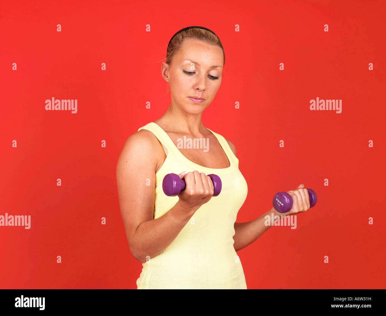 Young Woman Lifting Weights Model Released Stock Photo - Alamy