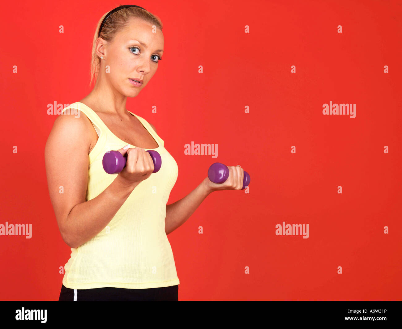Young Woman Lifting Weights Model Released Stock Photo - Alamy