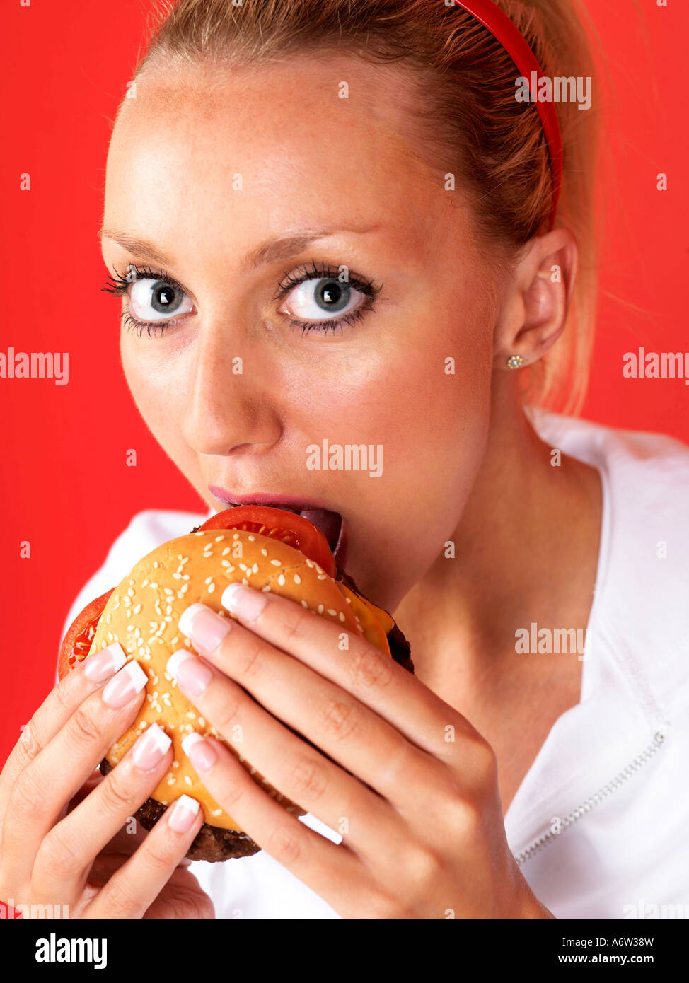 Young Woman Eating Hamburger Model Released Stock Photo - Alamy