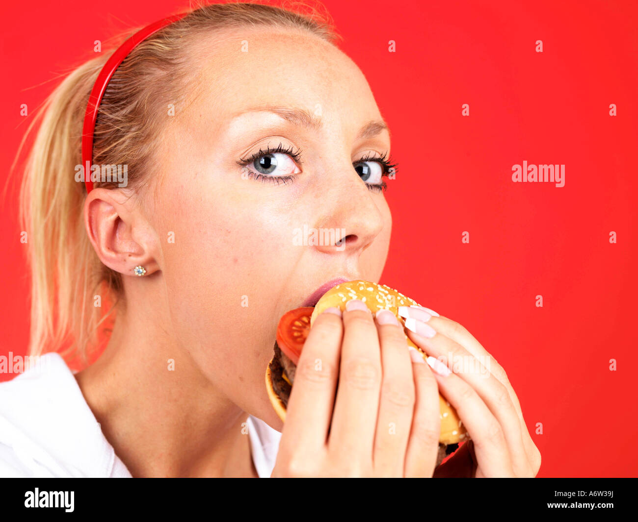 Young Woman Eating Hamburger Model Released Stock Photo - Alamy