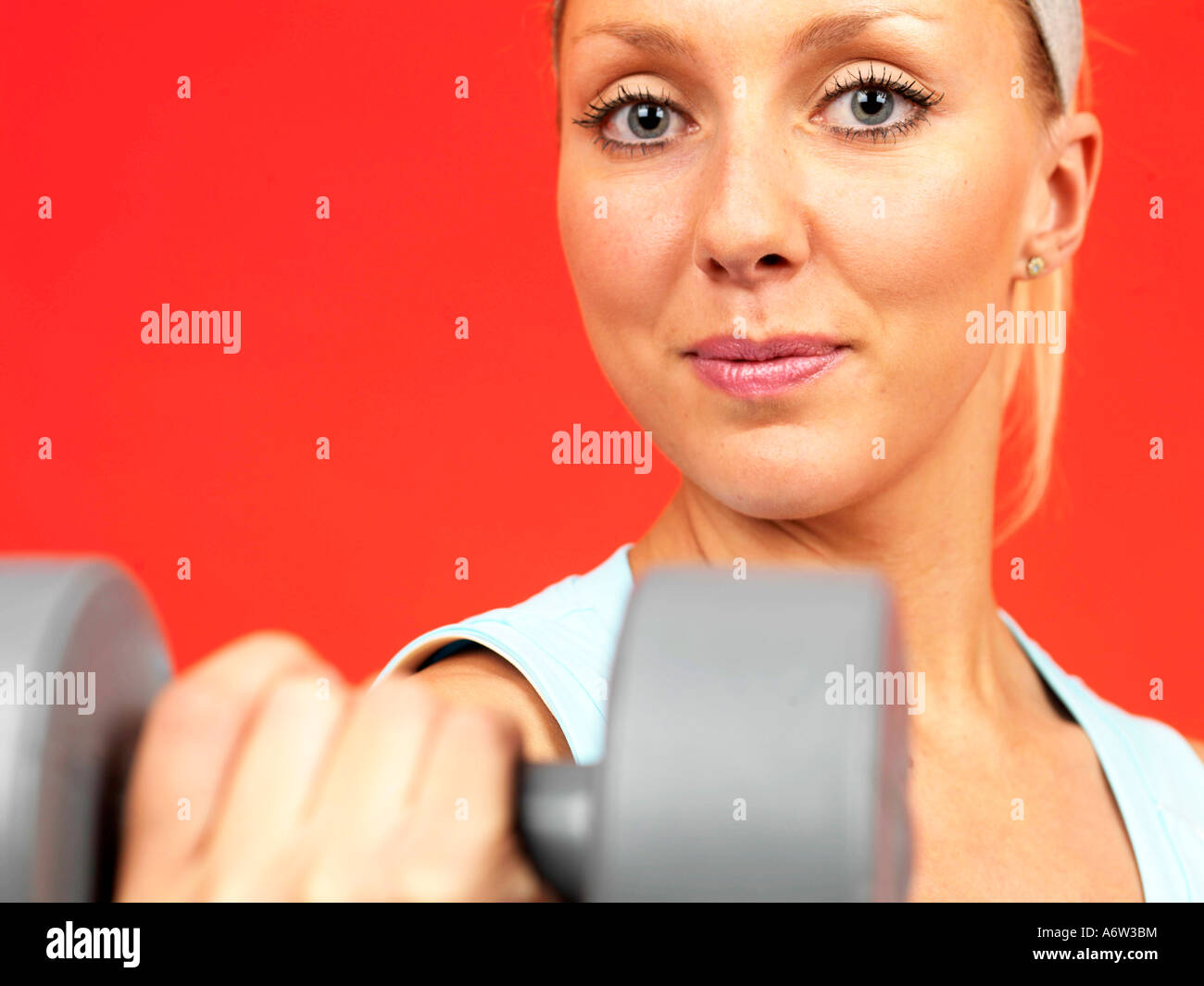 Young Woman Lifting Weights Model Released Stock Photo - Alamy
