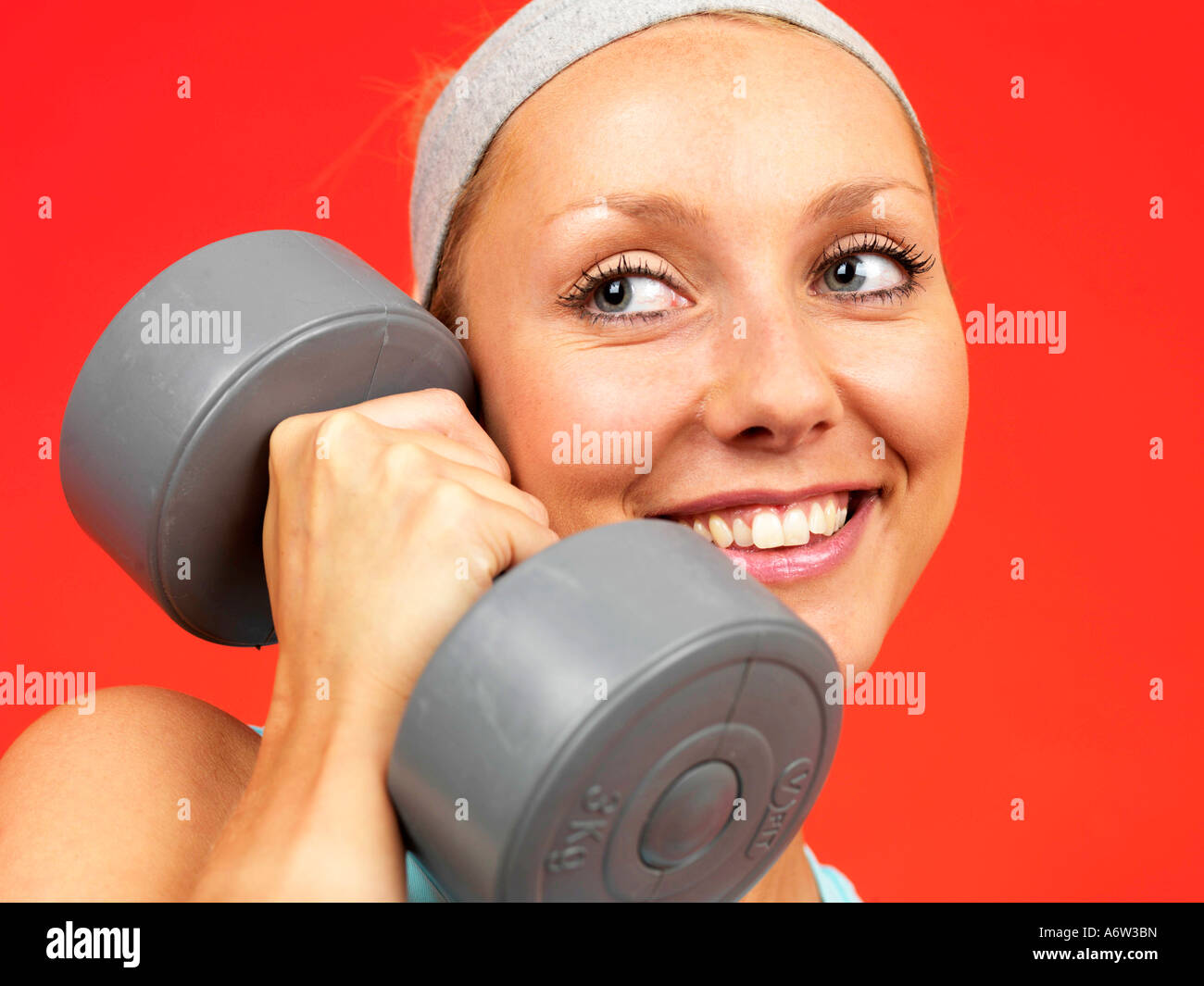 Young Woman Lifting Weights Model Released Stock Photo - Alamy