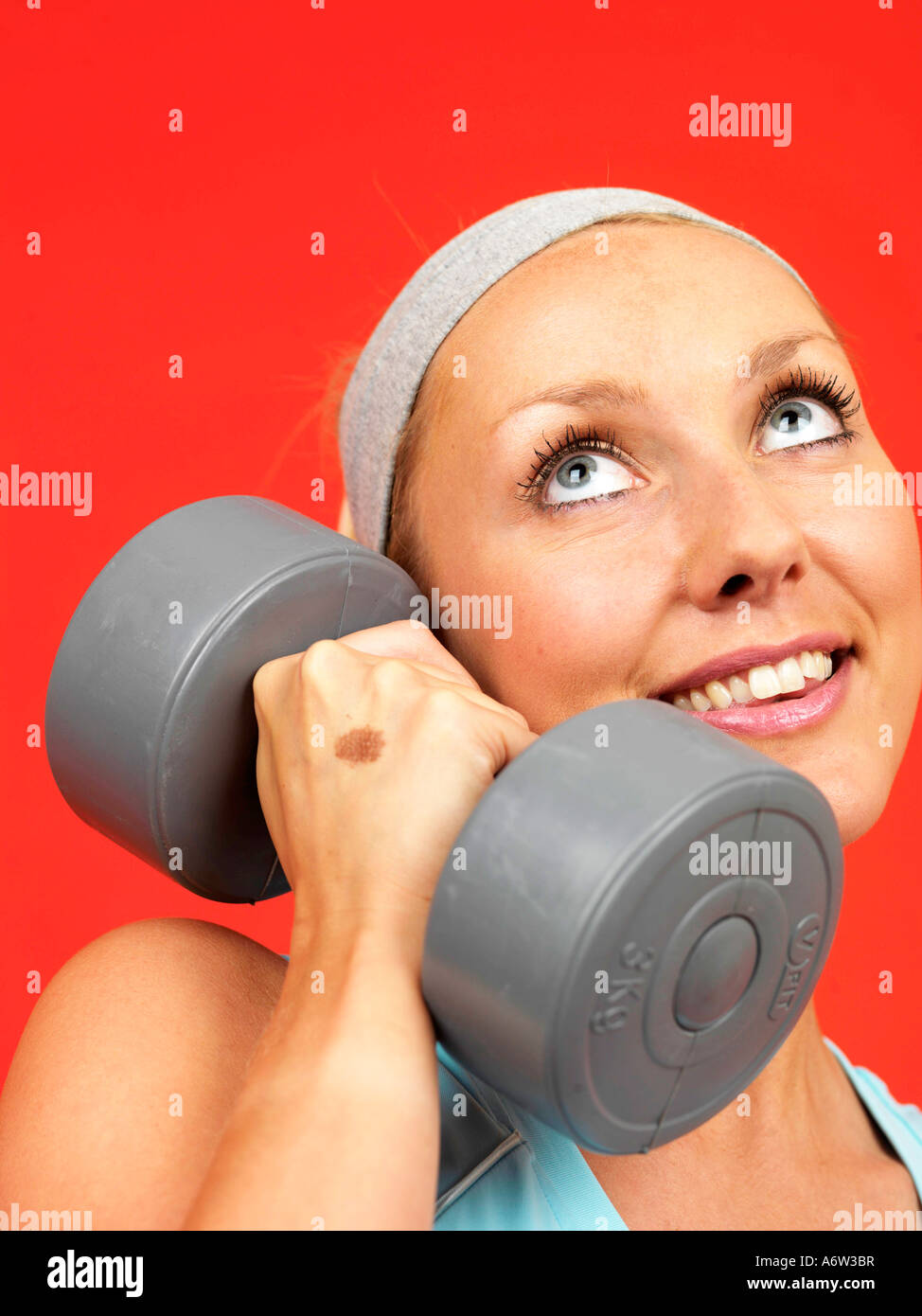 Young Woman Lifting Weights Model Released Stock Photo - Alamy