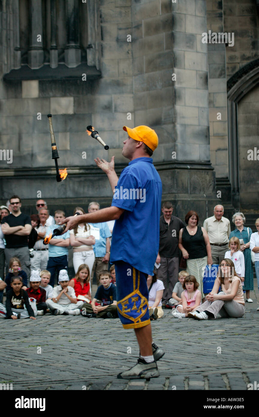 Street Performer juggling fire torches at the Edinburgh Fringe Festival ...