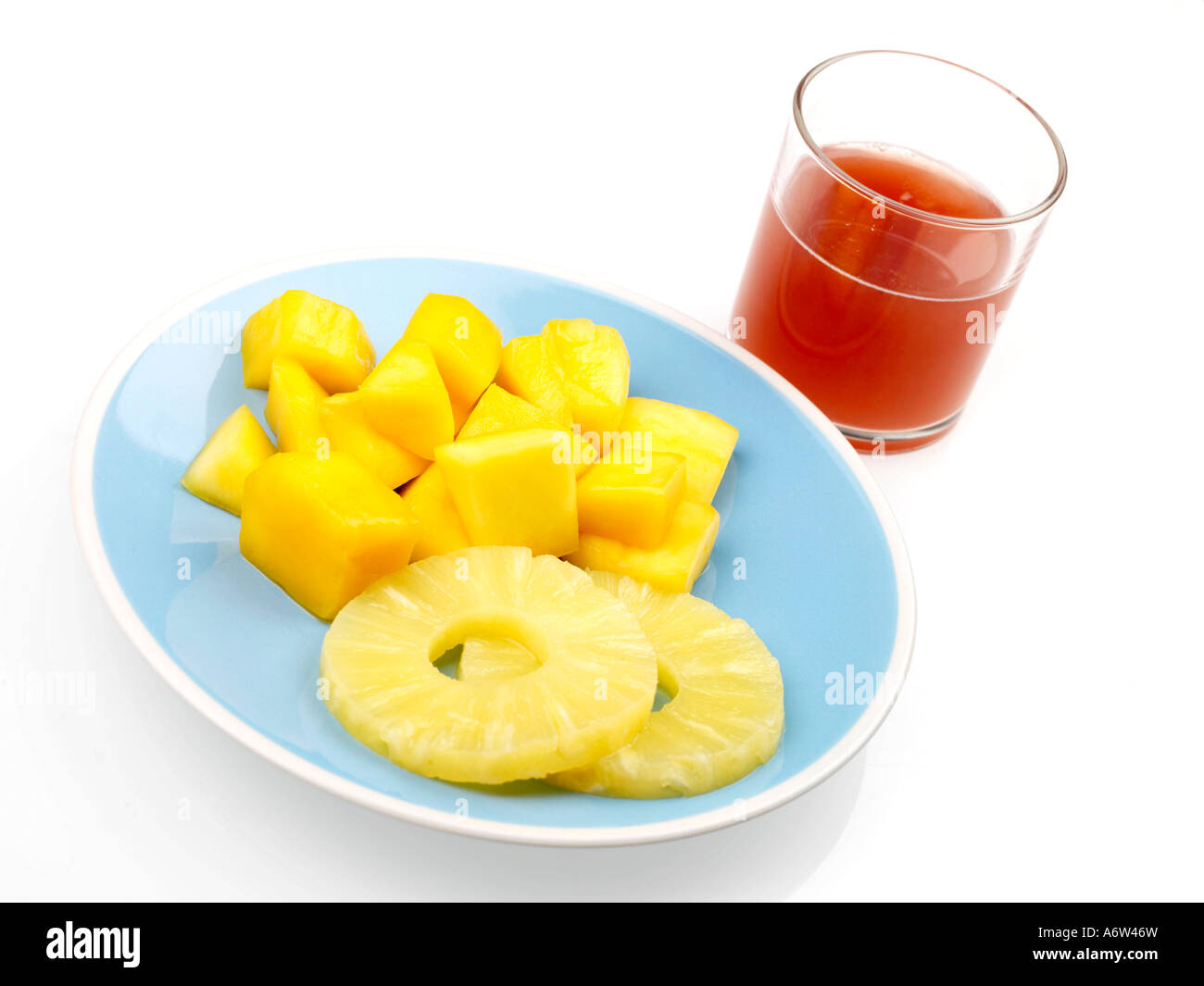 Mango and Pineapple with Fruit Juice Stock Photo - Alamy