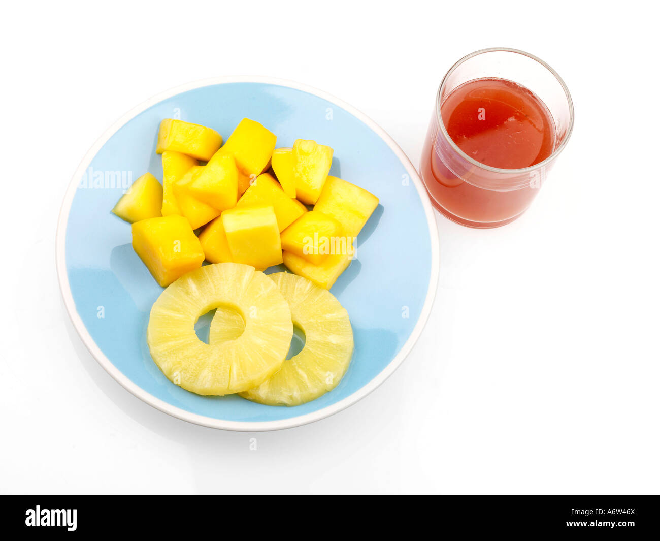 Mango and Pineapple with Fruit Juice Stock Photo - Alamy