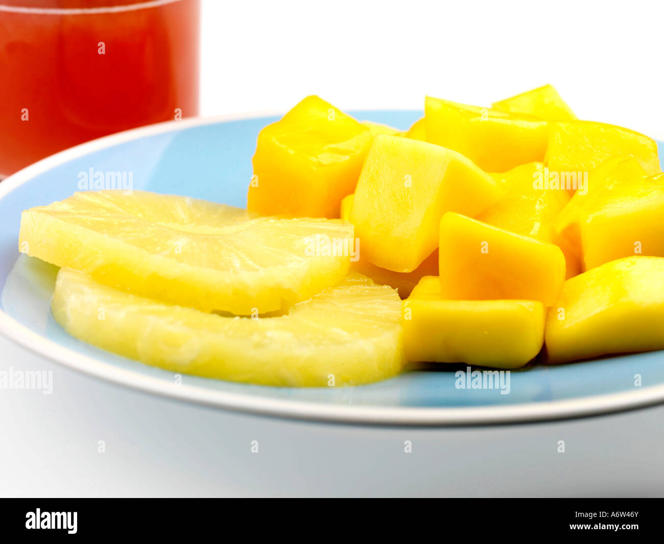 Mango and Pineapple with Fruit Juice Stock Photo - Alamy