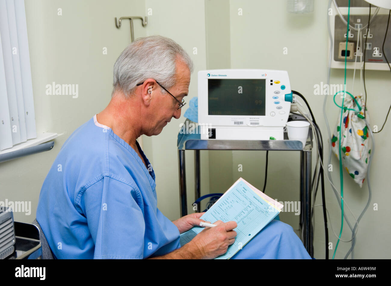 Doctor taking records Stock Photo - Alamy