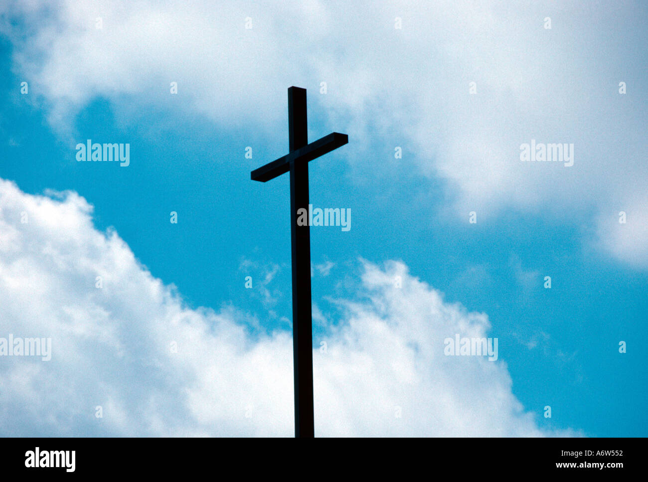 Church cross against blue sky with clouds Stock Photo - Alamy