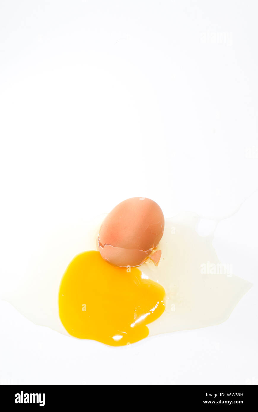 Smashed egg on a white background Stock Photo - Alamy