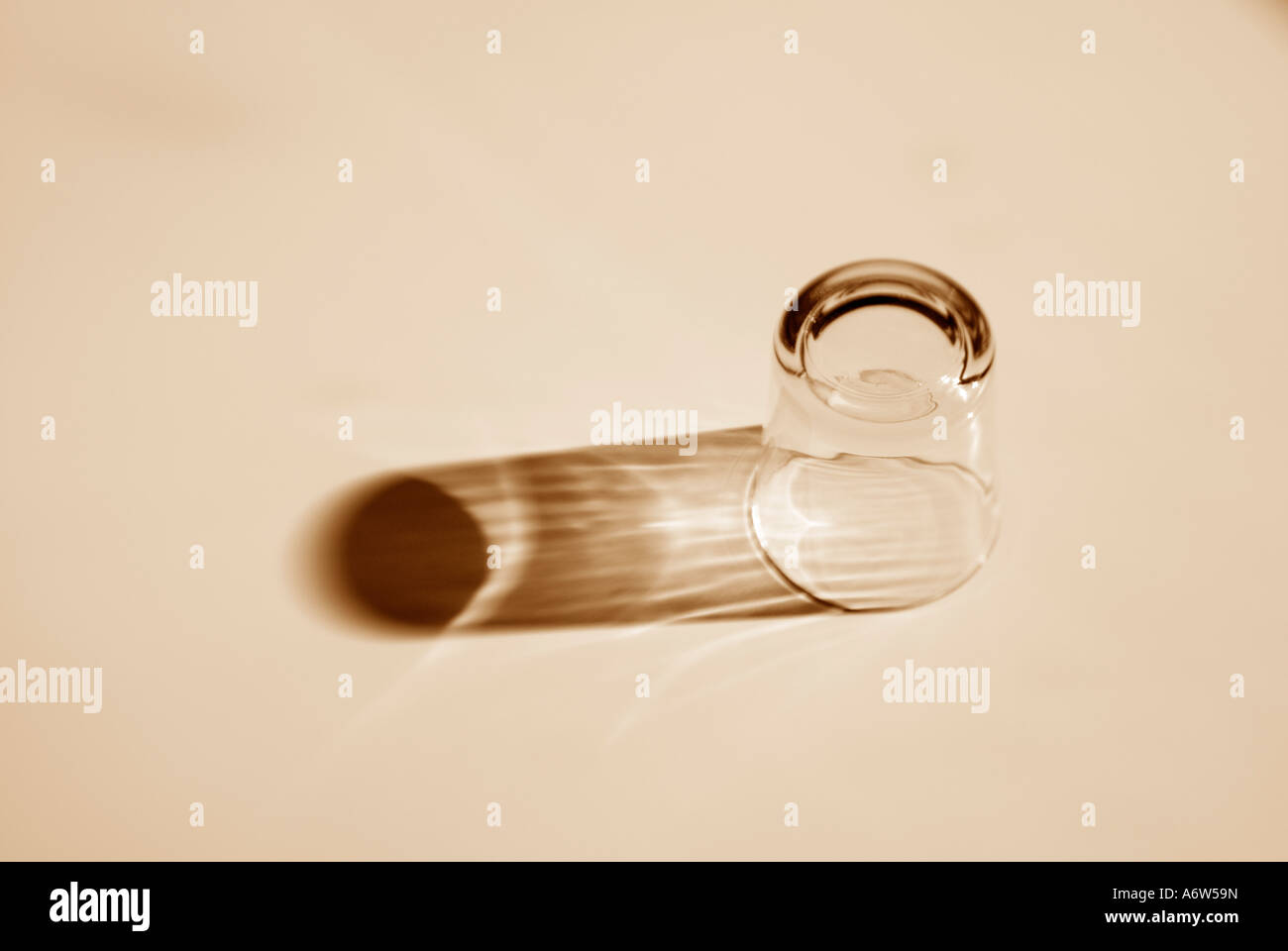 Sepia toned glass upside down Stock Photo - Alamy