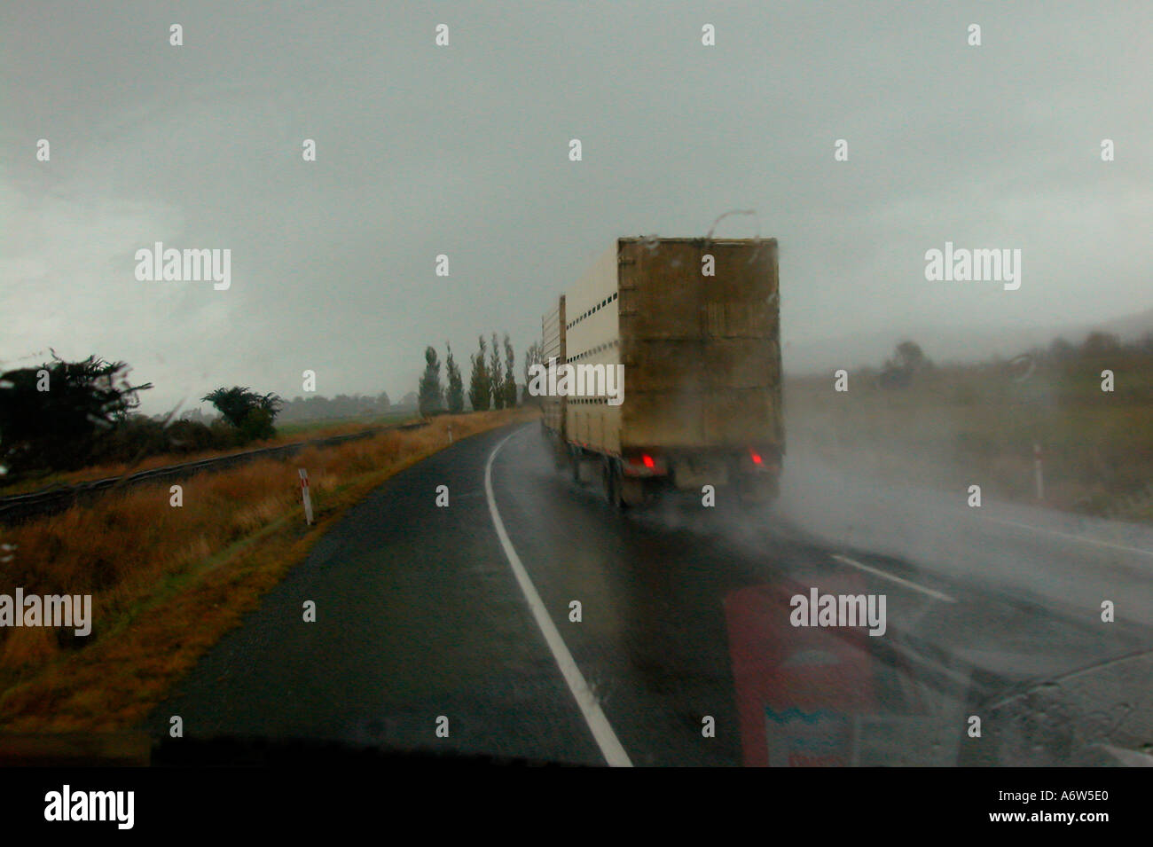 TRUCK PASSING IN RAIN Stock Photo - Alamy