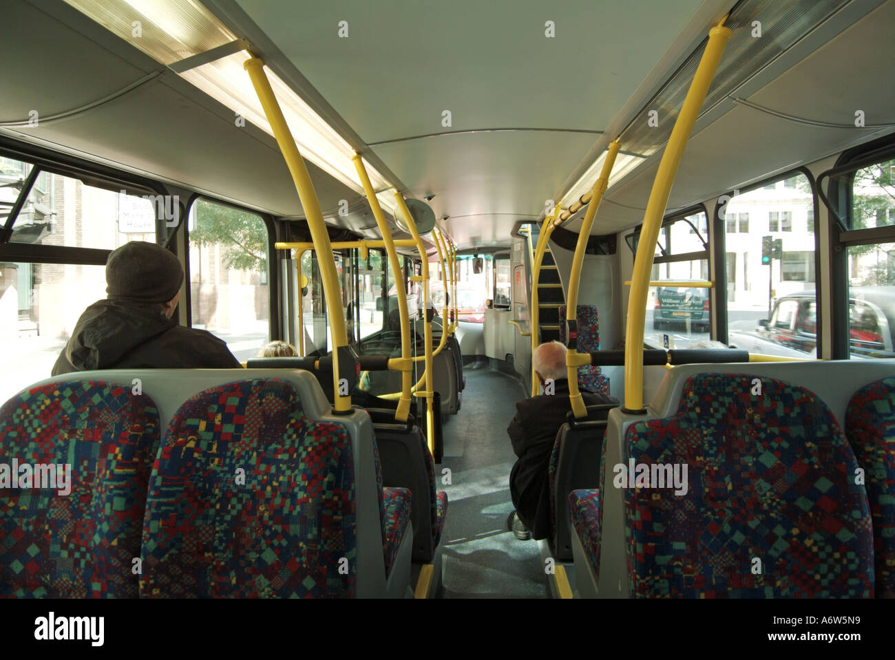 London interior view of lower deck of a double deck bus Stock Photo - Alamy