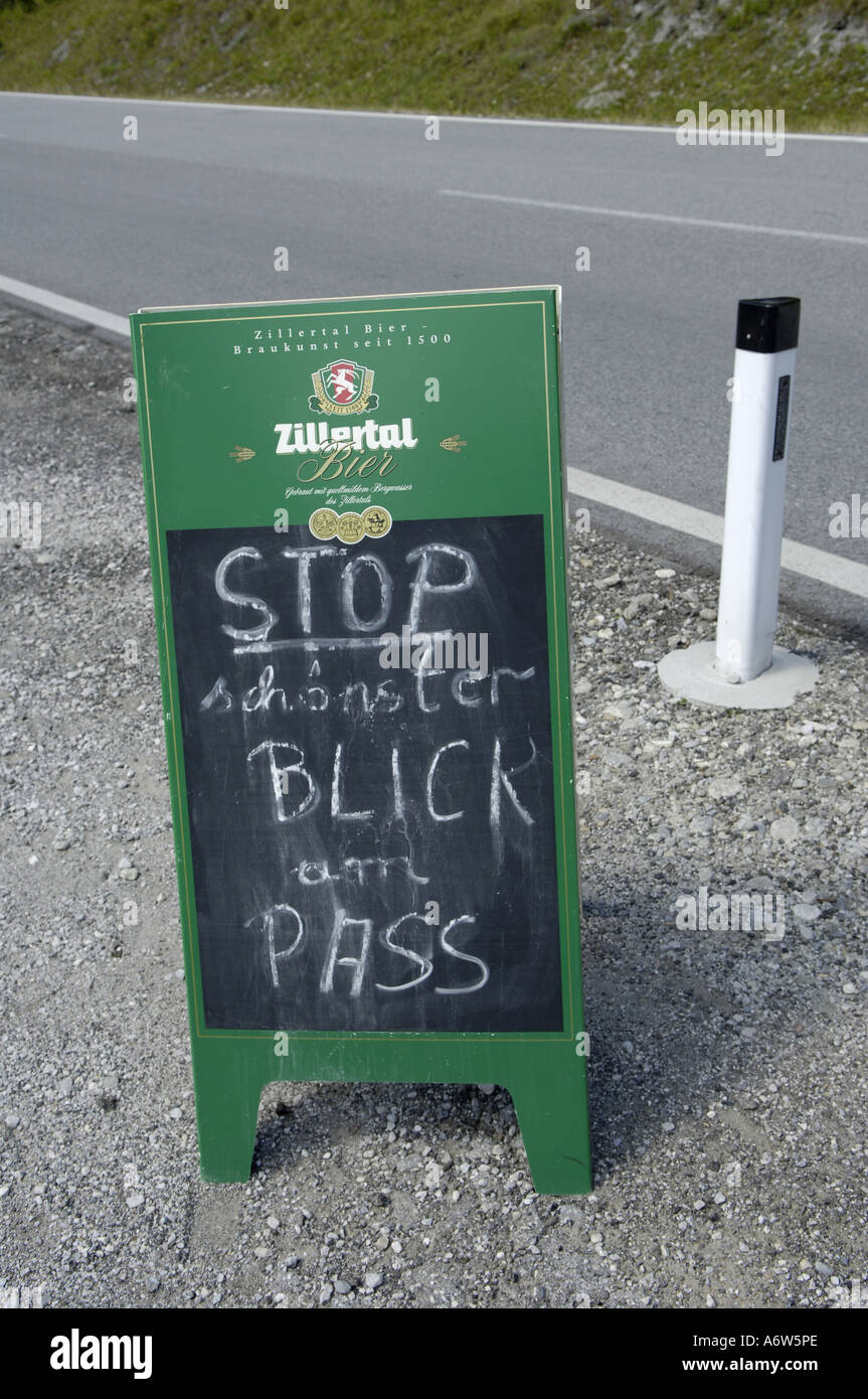 sign with the advertisement for the most beautiful view on the pass ...