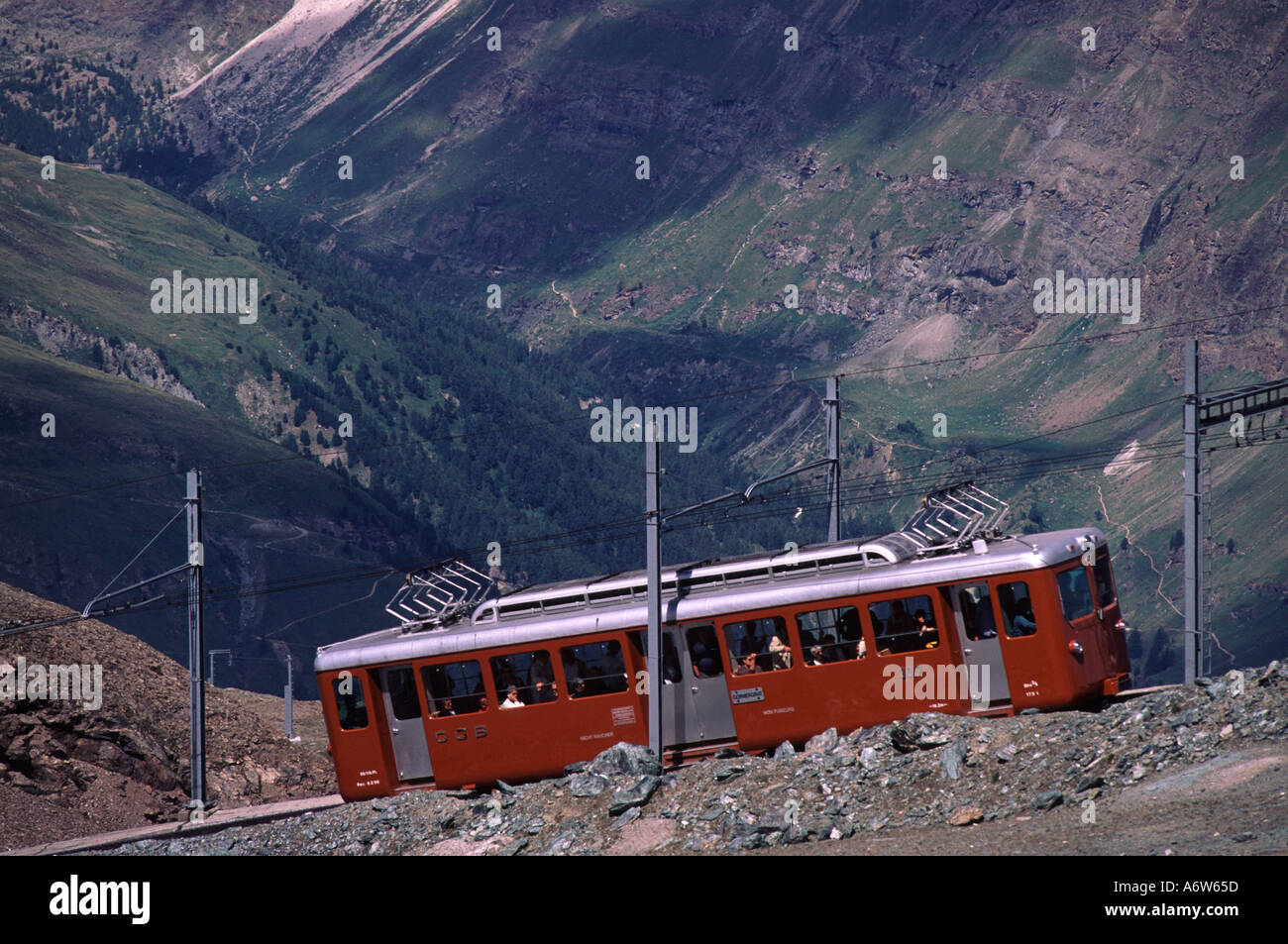 Gornergratt rack and pinion train on a steep gradient in alpine ...