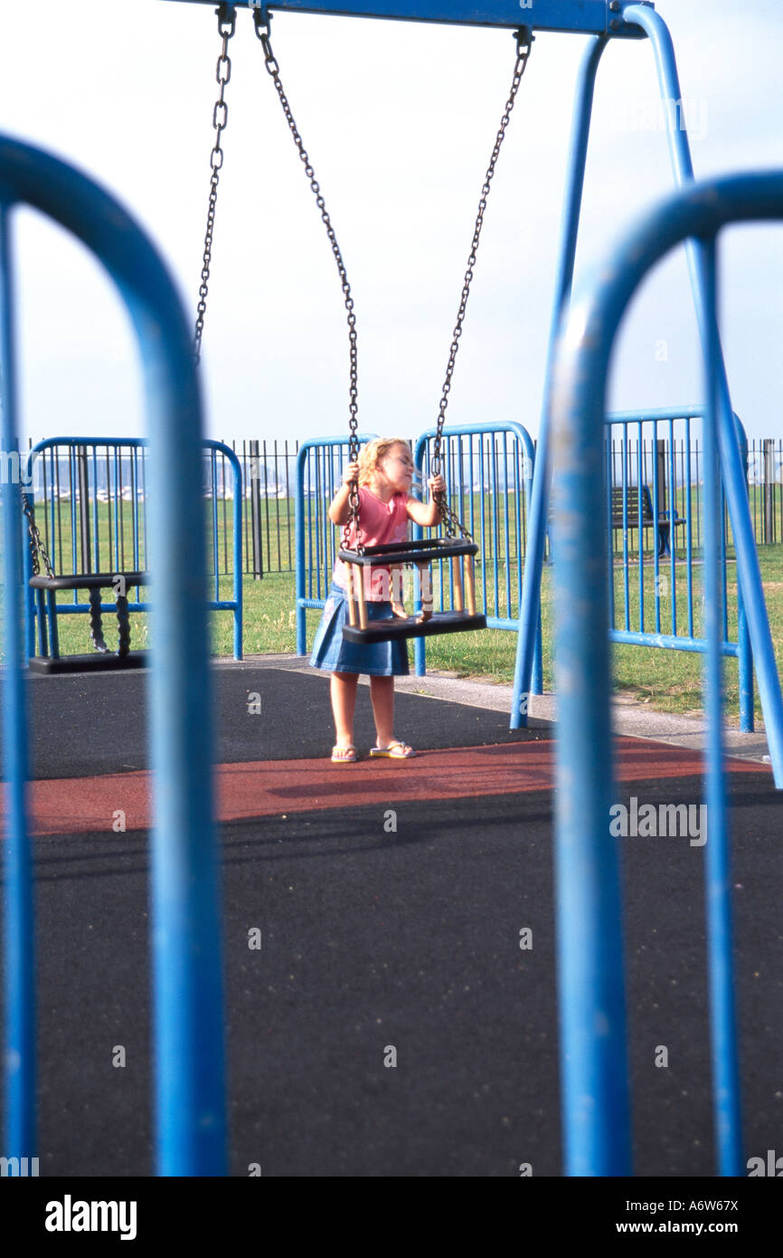 Young Girl Using Swing Model Released Stock Photo - Alamy