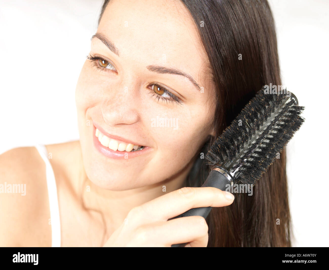 Young Woman Brushing Hair Model Released Stock Photo - Alamy