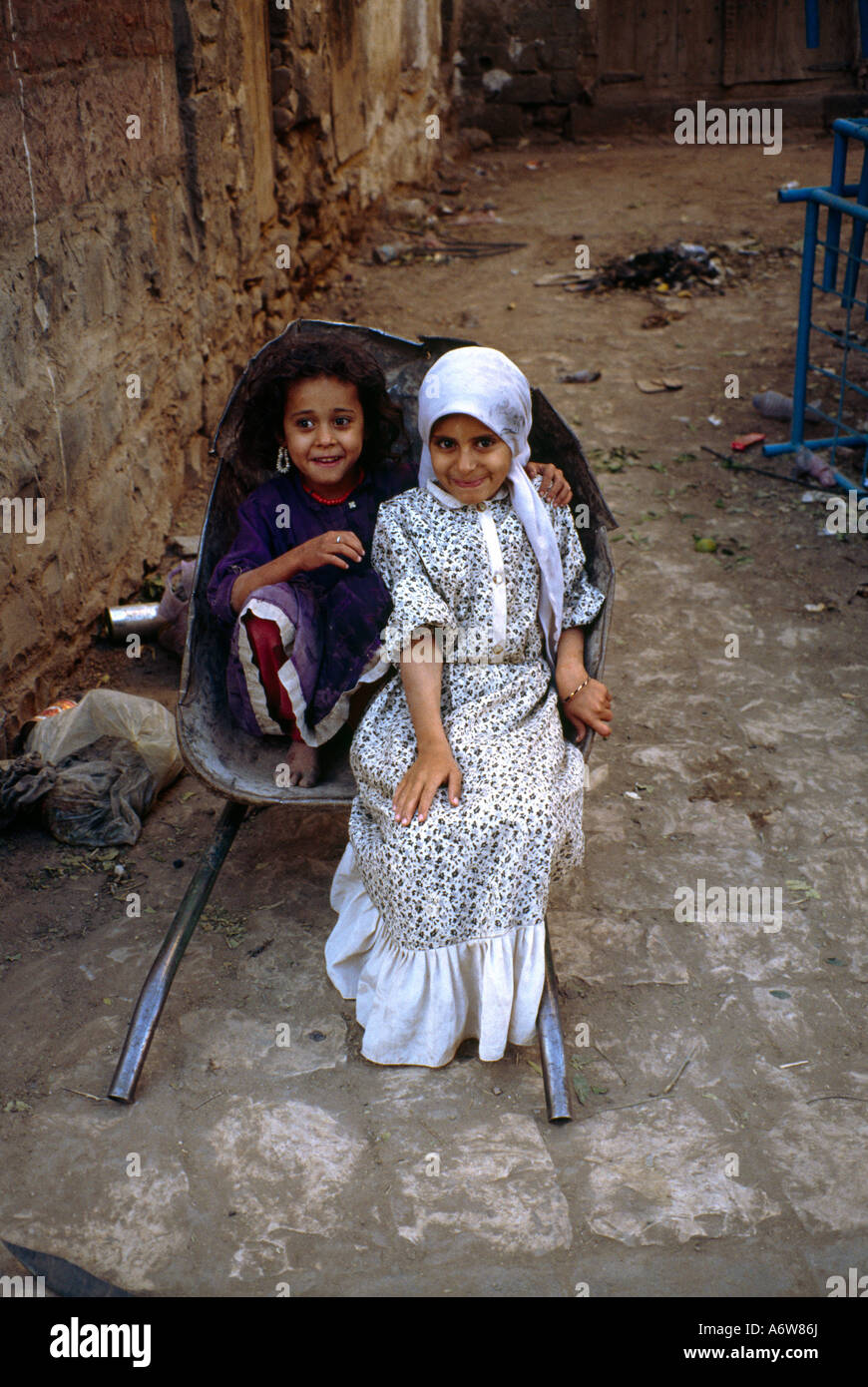 Sana'a Yemen Girls In Traditional Dress sitting in Wheelbarrow Stock ...