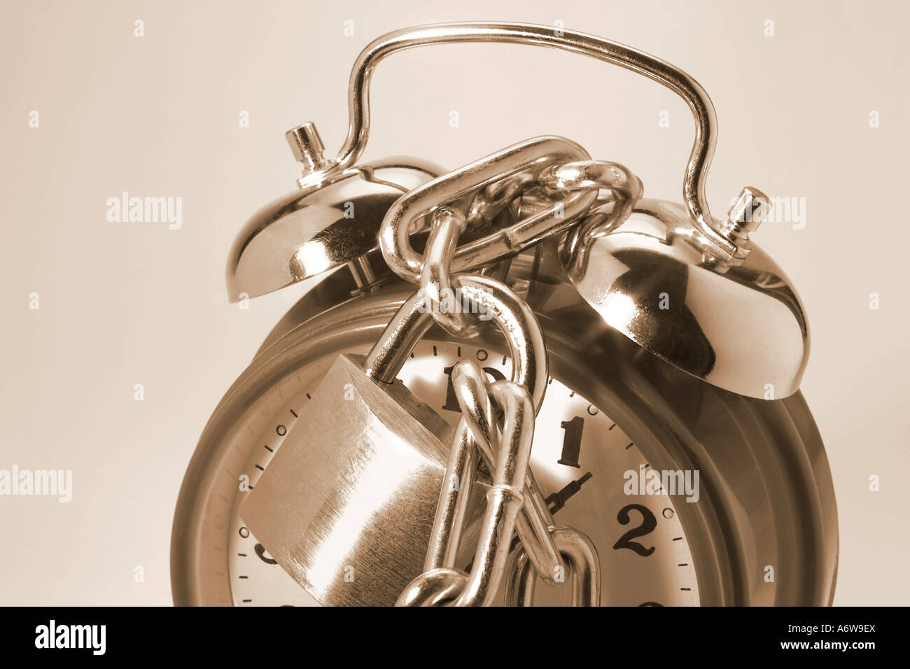 Alarm Clock with Chain and Lock Stock Photo - Alamy