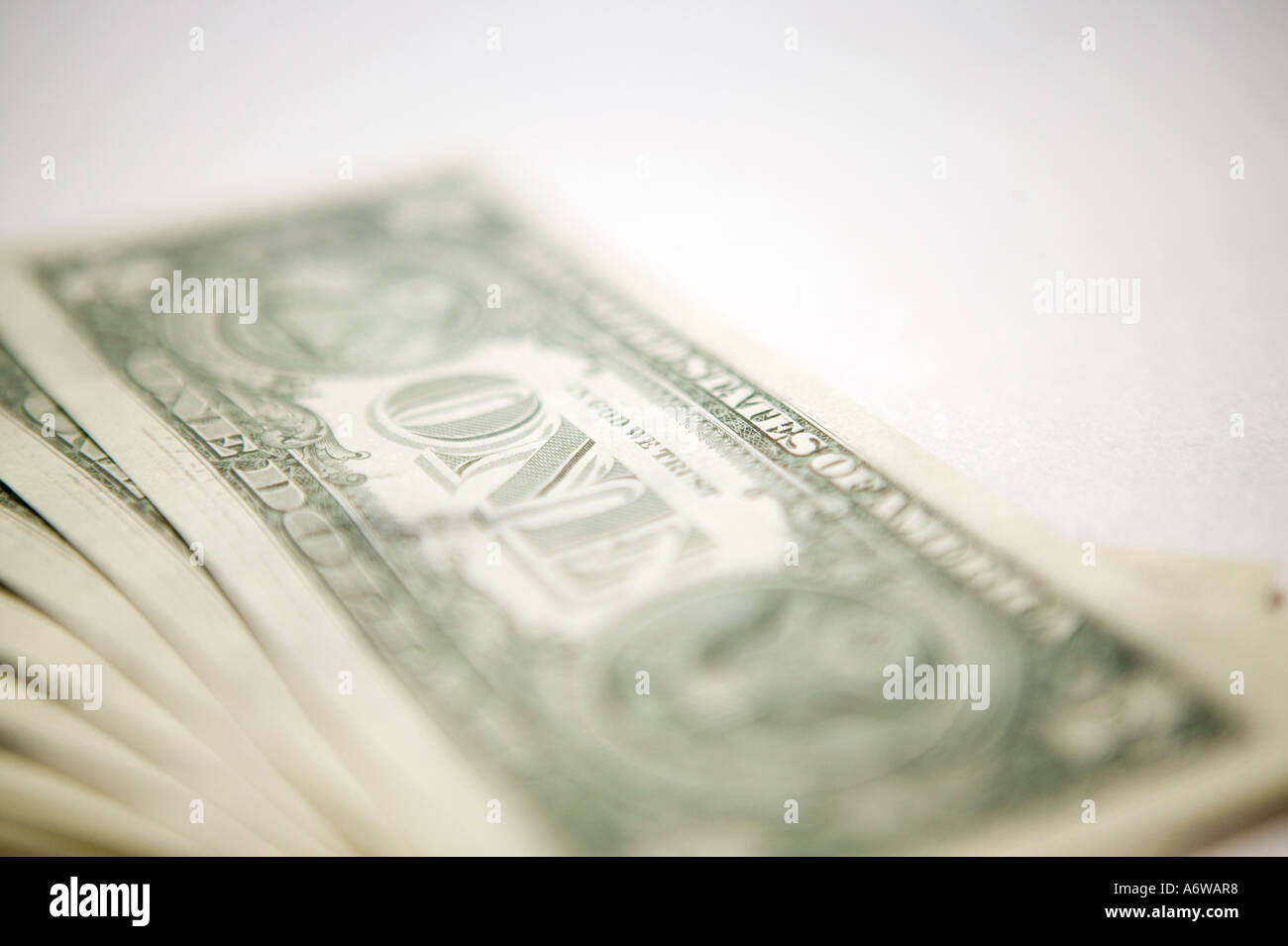 Studio shot of seven clean one dollar notes faned out on a plain white ...