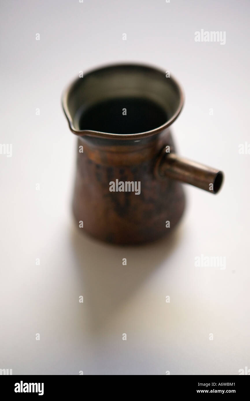 Studio shot of a metal coffee container on a plain white background ...