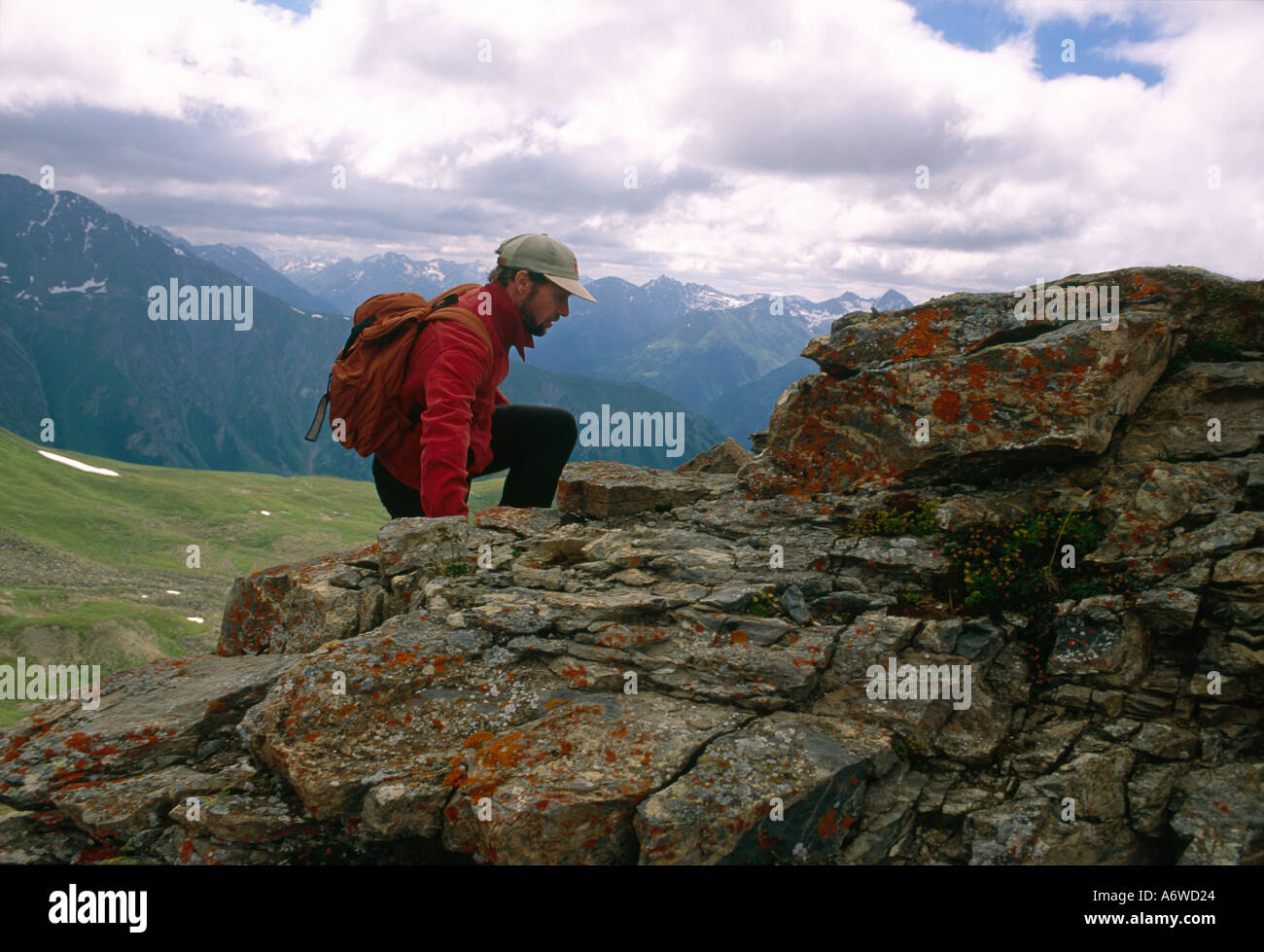 Male hiker reaching up top hi-res stock photography and images - Alamy