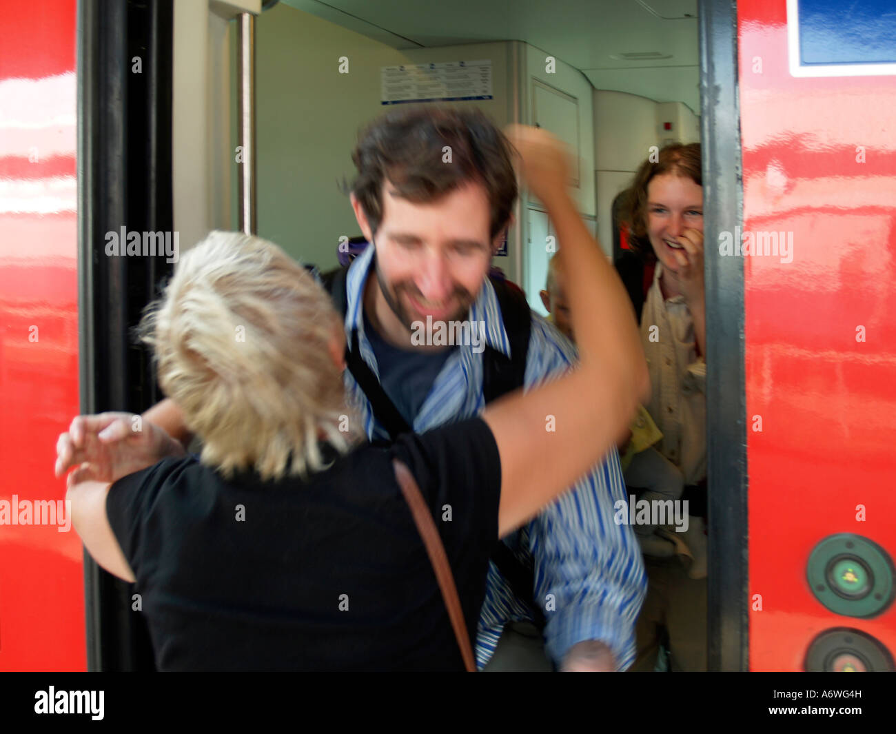 MR people in embracing by leave taking welcoming at the door of a Stock ...