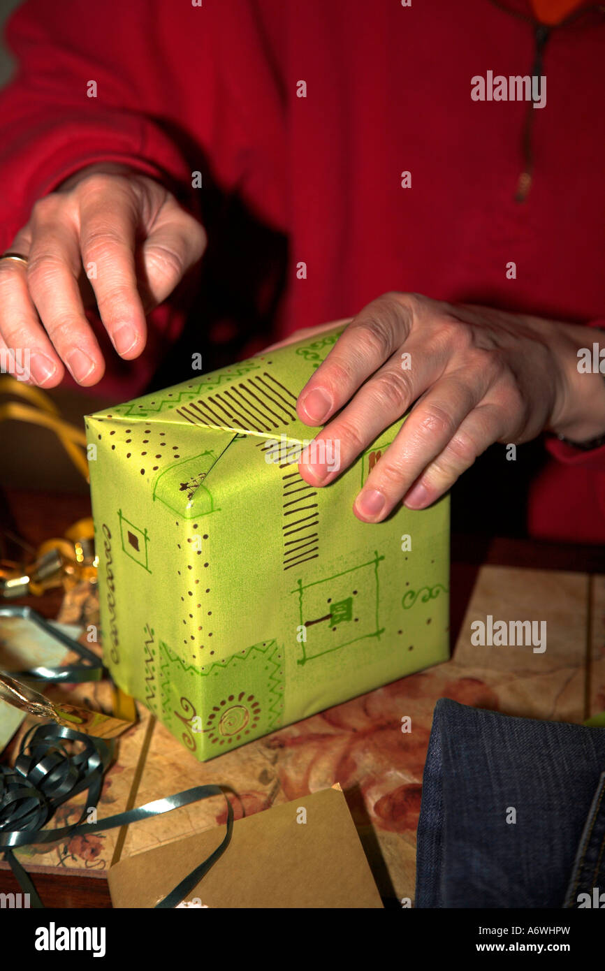 A Present,opening a present,two hands ,fingers Stock Photo - Alamy