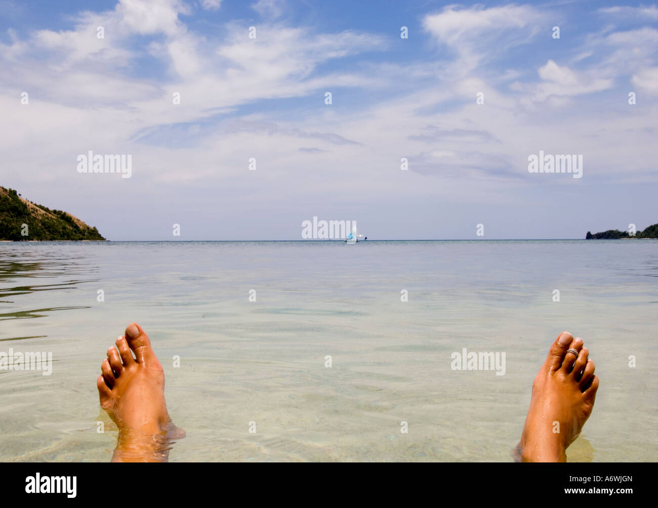 human feet and view of clear sea Stock Photo - Alamy