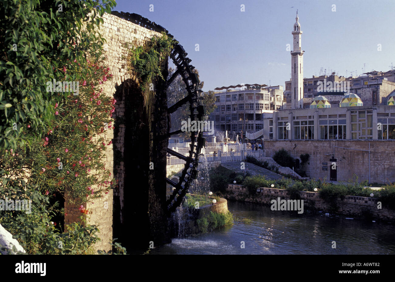 Syria, Hama, Wooden Waterwheel and the al-Nuri Mosque on the Orontes ...
