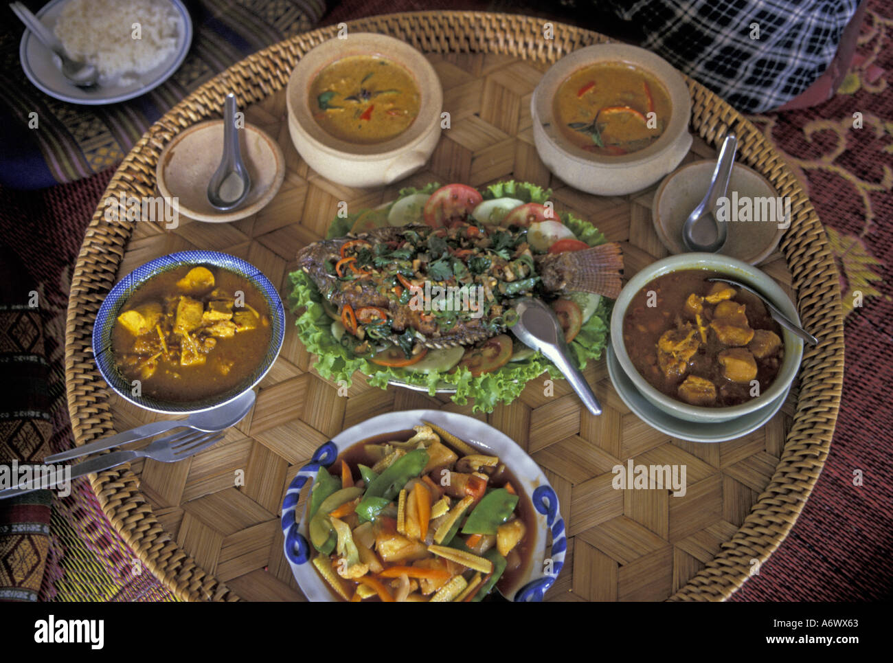 Asia, Thailand, Northern Thailand, Chang Mai, Thai food dishes on woven ...