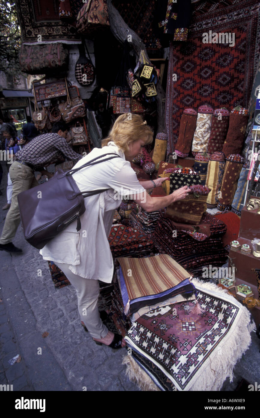 Istanbul, Turkey People shopping for woven goods at outdoor market ...