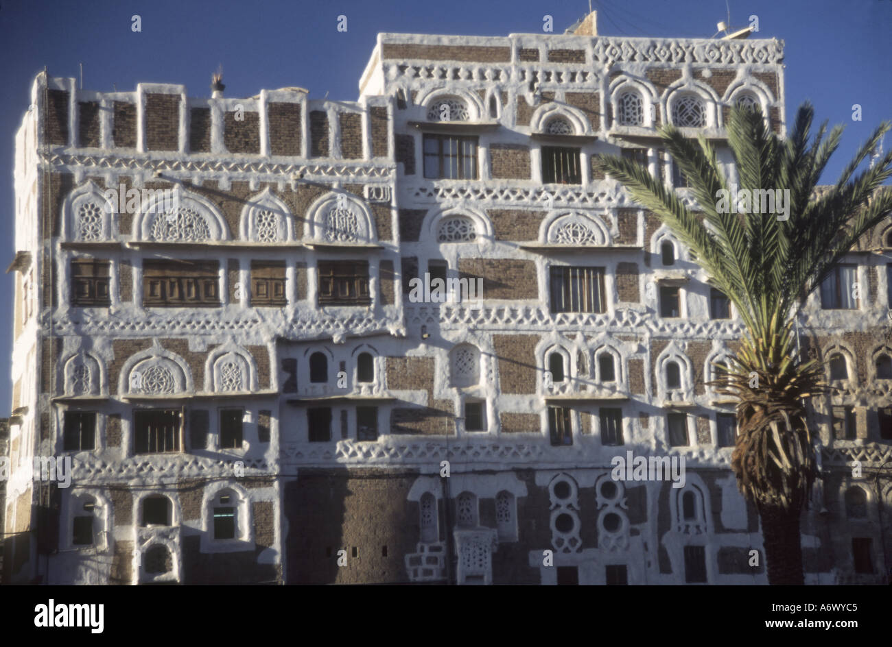 Yemen, Sana'a, Yemeni house and palm tree, near Bab Al Sabah, old city ...