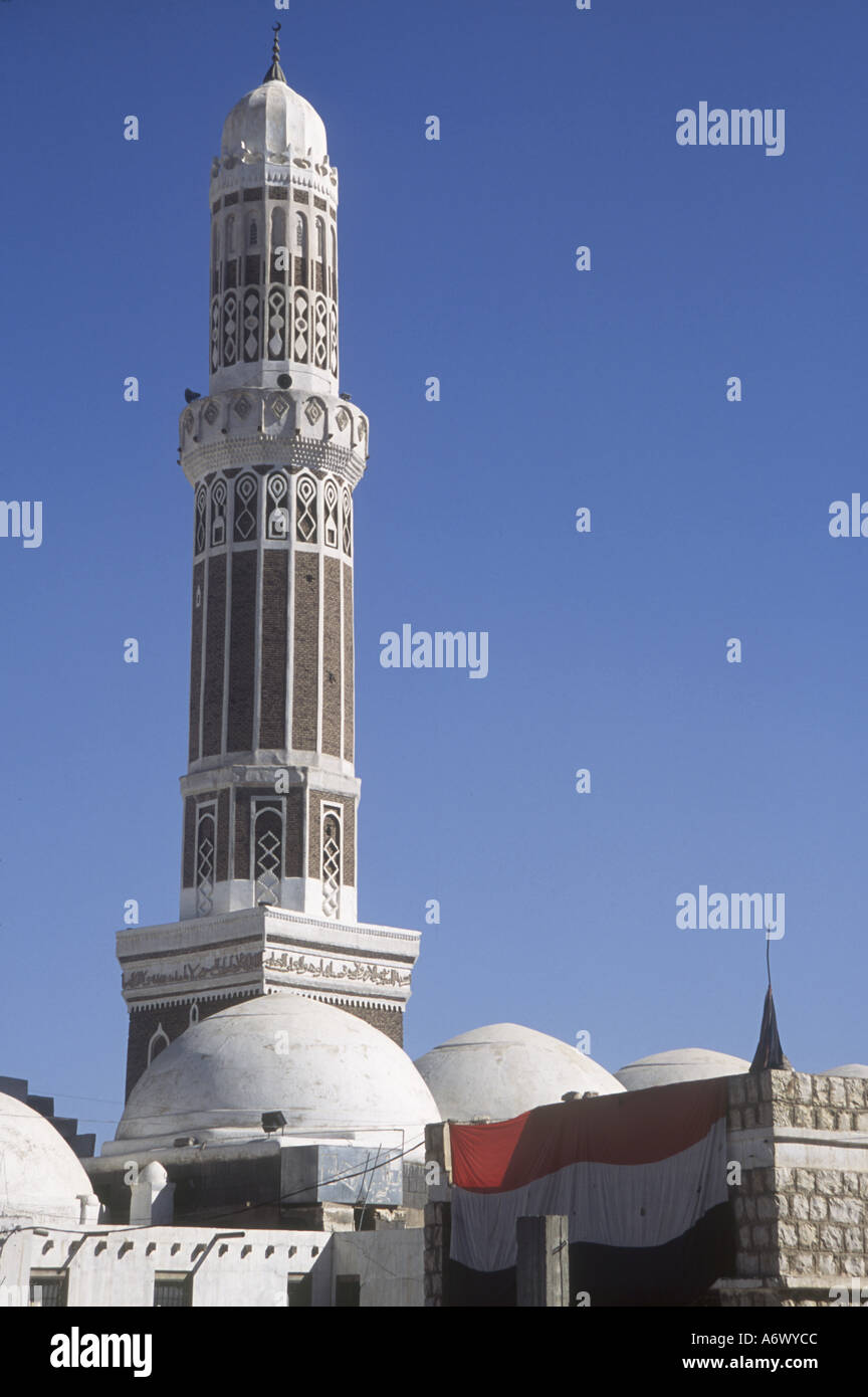 Yemen, Sana'a, Mosque with multiple domes and minaret, with Yemeni flag ...