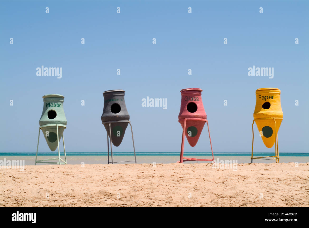 Recycling bins on beach Stock Photo - Alamy
