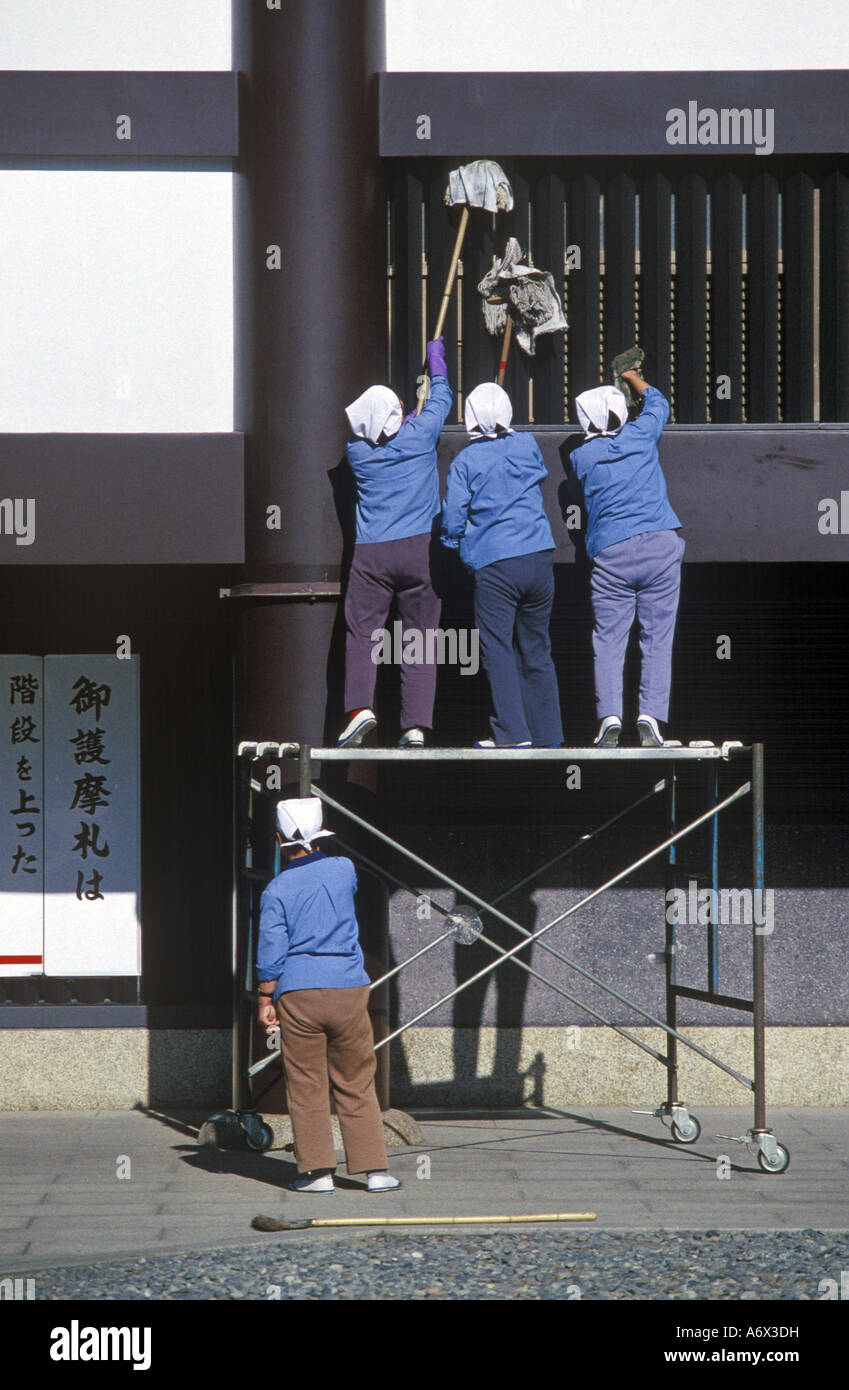 Four cleaners at Narita temple near Tokyo, Japan Stock Photo - Alamy
