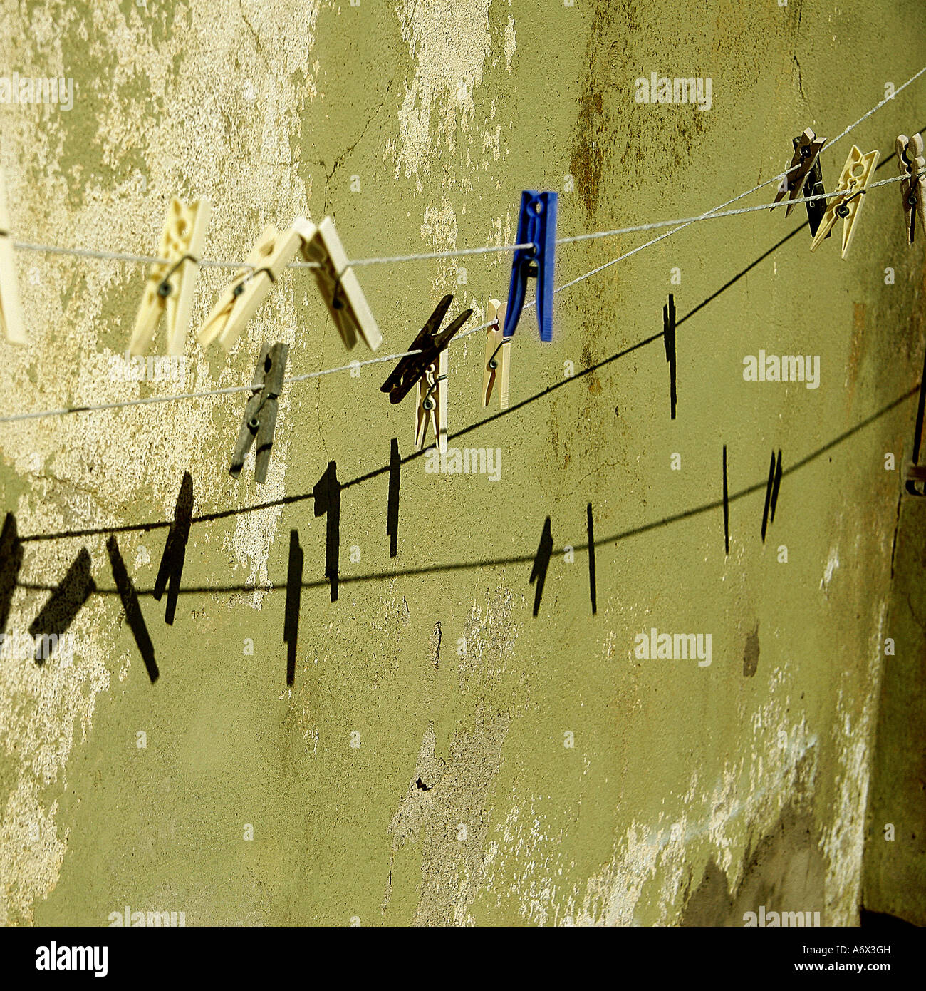 Clothespins hanging on clotheslines Stock Photo - Alamy