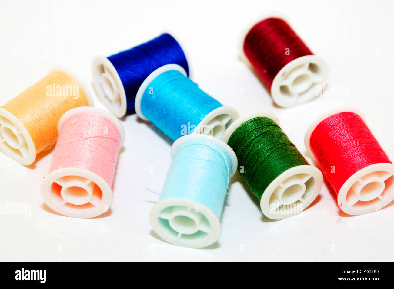Sewing cottons on spools Stock Photo - Alamy