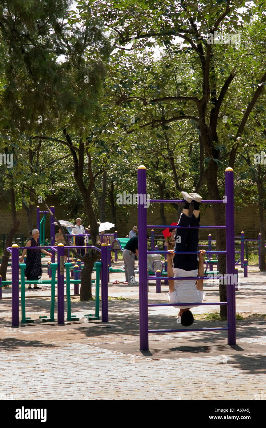 Man doing morning exercise at the Temple of Heaven park Beijing China ...