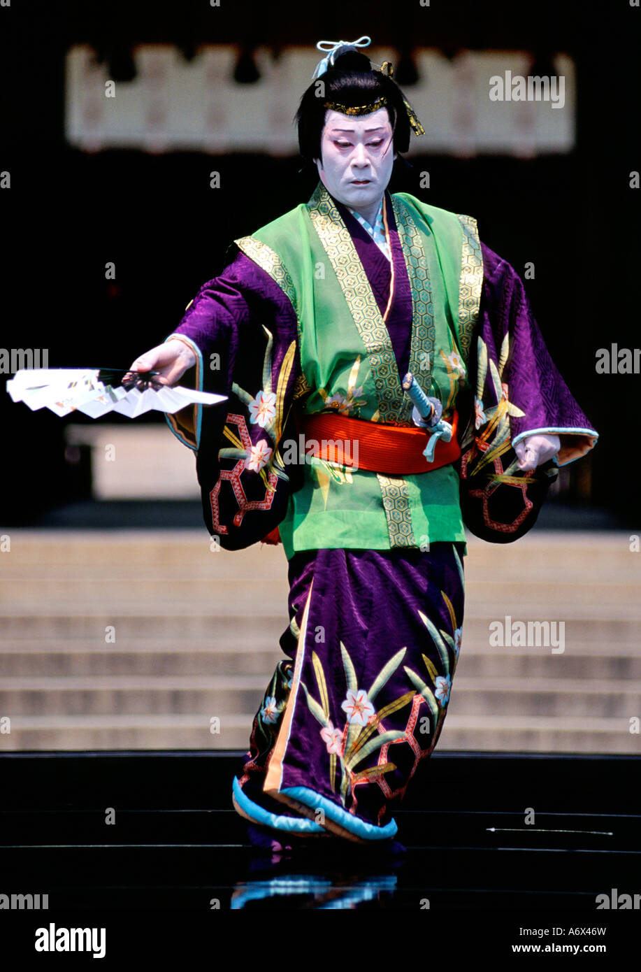 A Japanese dancer performs a traditional dance at a ceremony in the ...