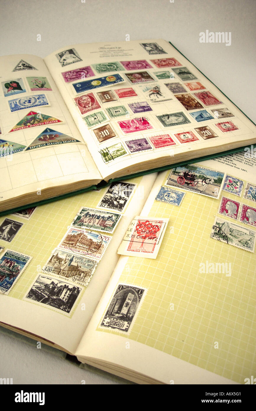 An open stamp album displaying a stamp collection Stock Photo - Alamy