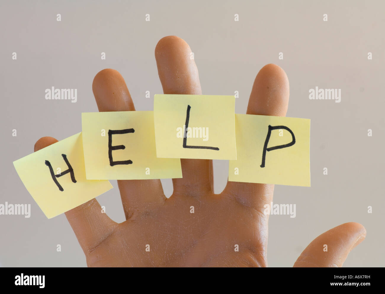 human hand with post it notes spelling HELP on fingers Stock Photo - Alamy