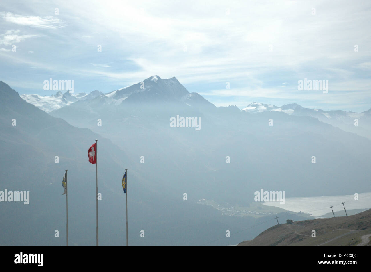 View over the Swiss Alps with Swiss flags Stock Photo - Alamy